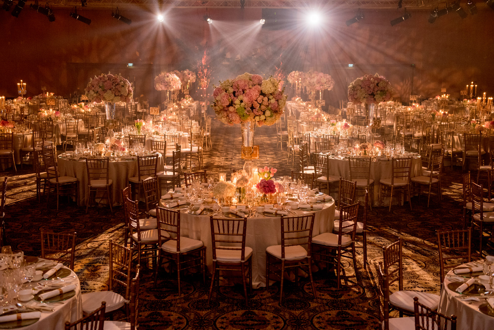 Luxury reception spotlights raised centerpieces - Morgan Lynn Photography