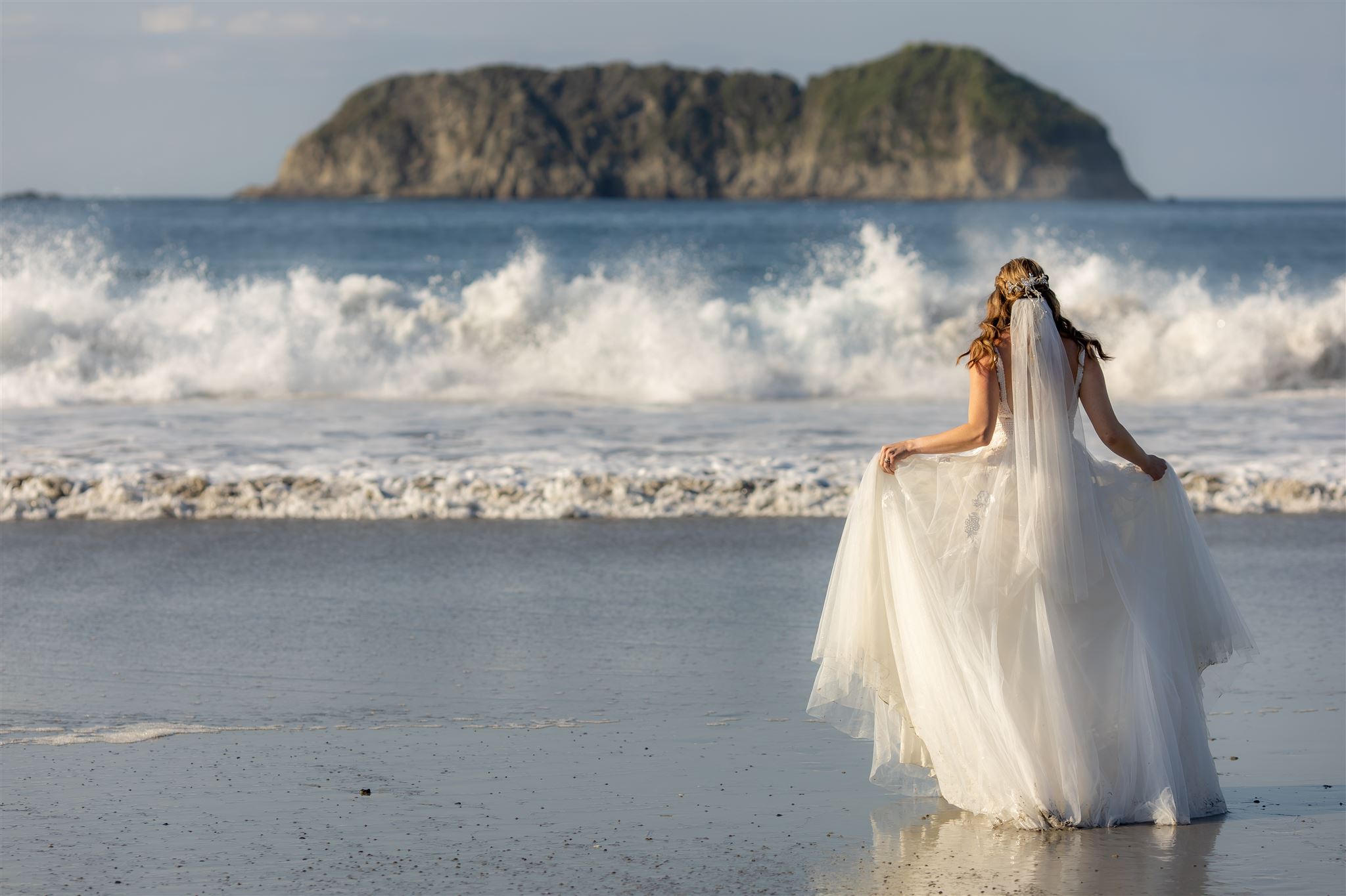 Bride at water's edge - photo by Kevin Heslin Photography