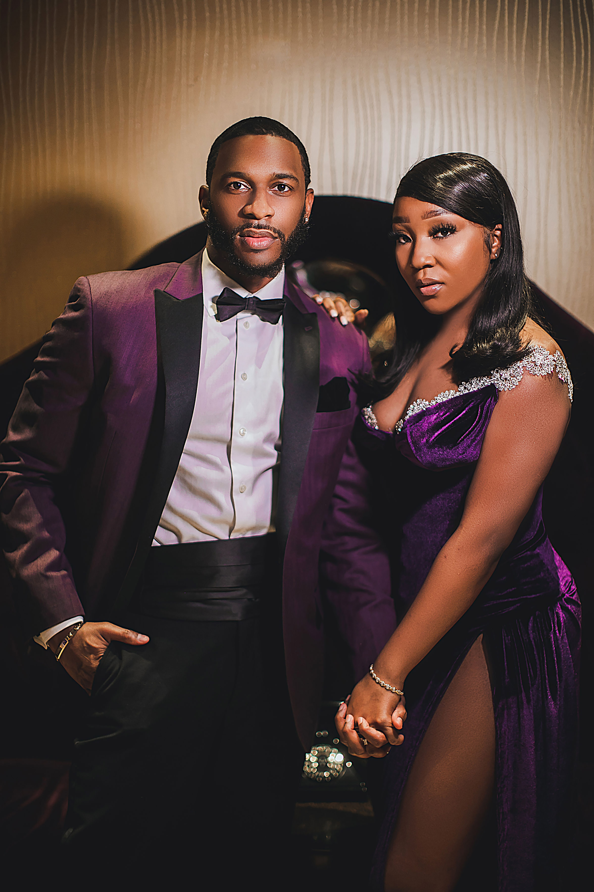 Elegant couple pose in deep purple garments - photo by YNOT iMages