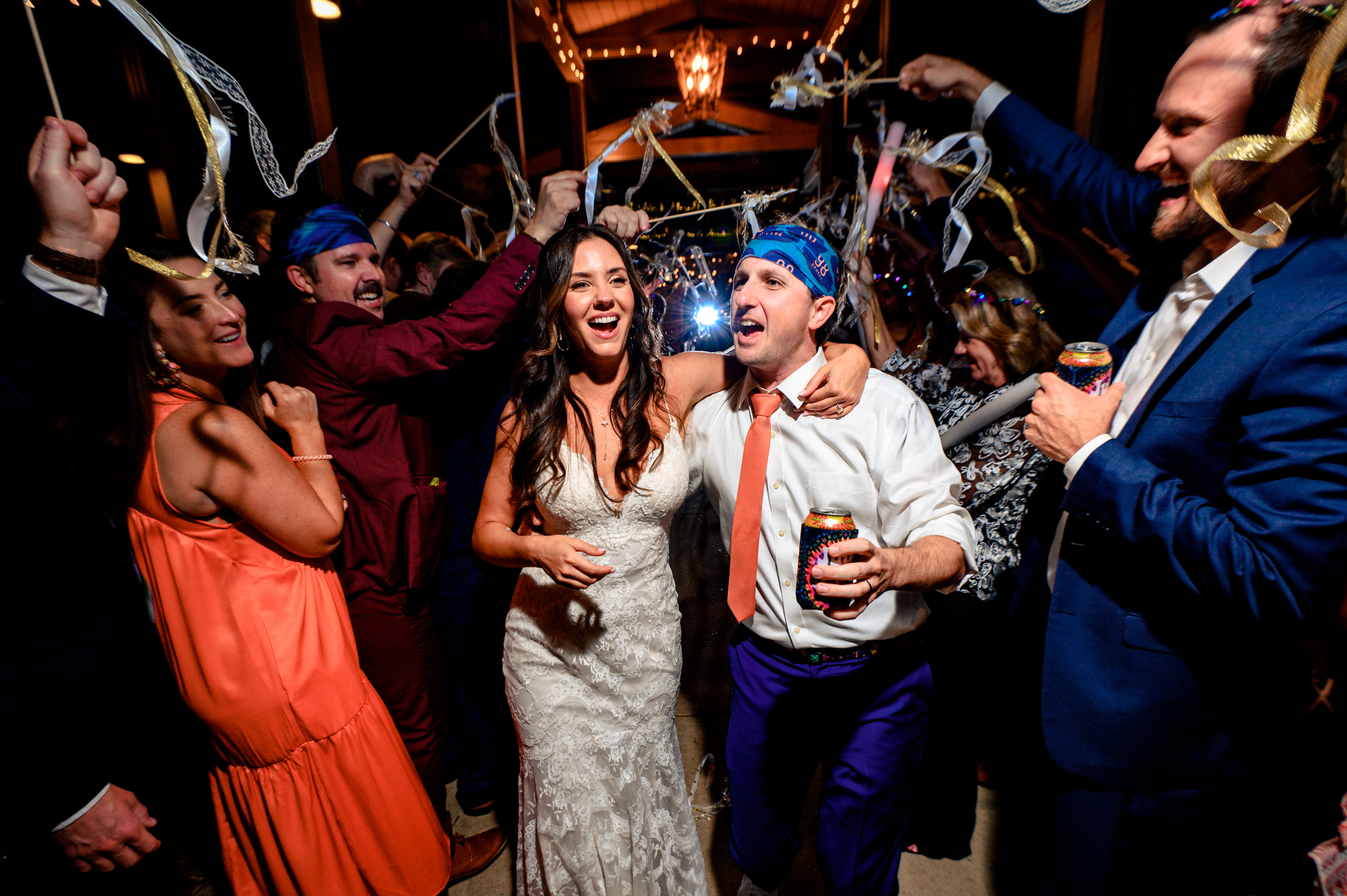 Fun couple exit under streamers - photo by Michael Freas
