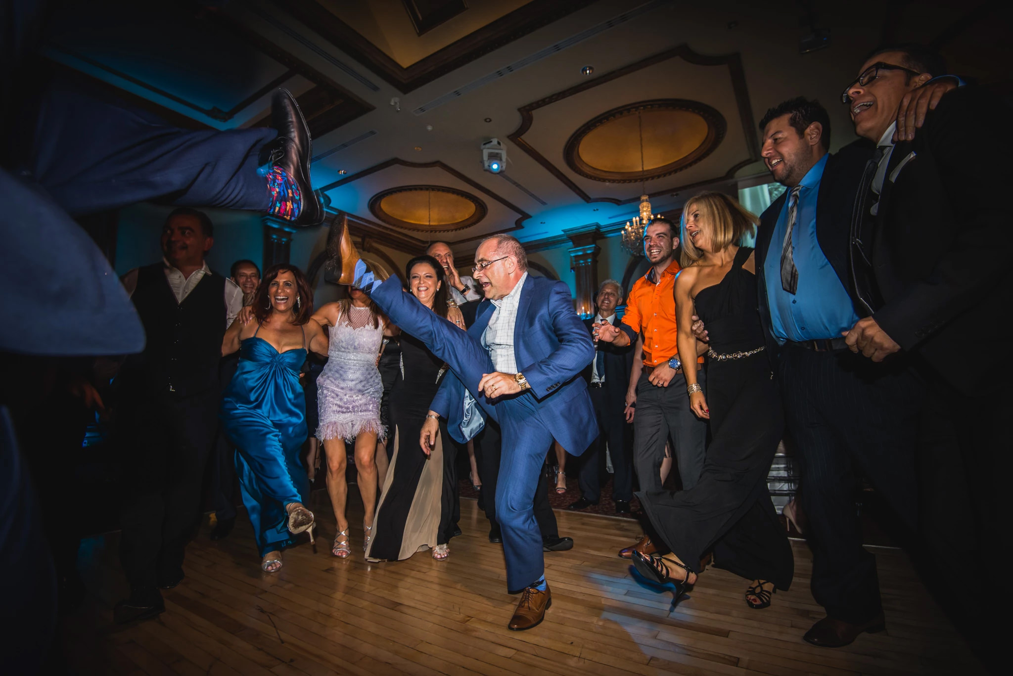 Fun dance floor shot of dad doing a big kick - photo by Robert Mauriell