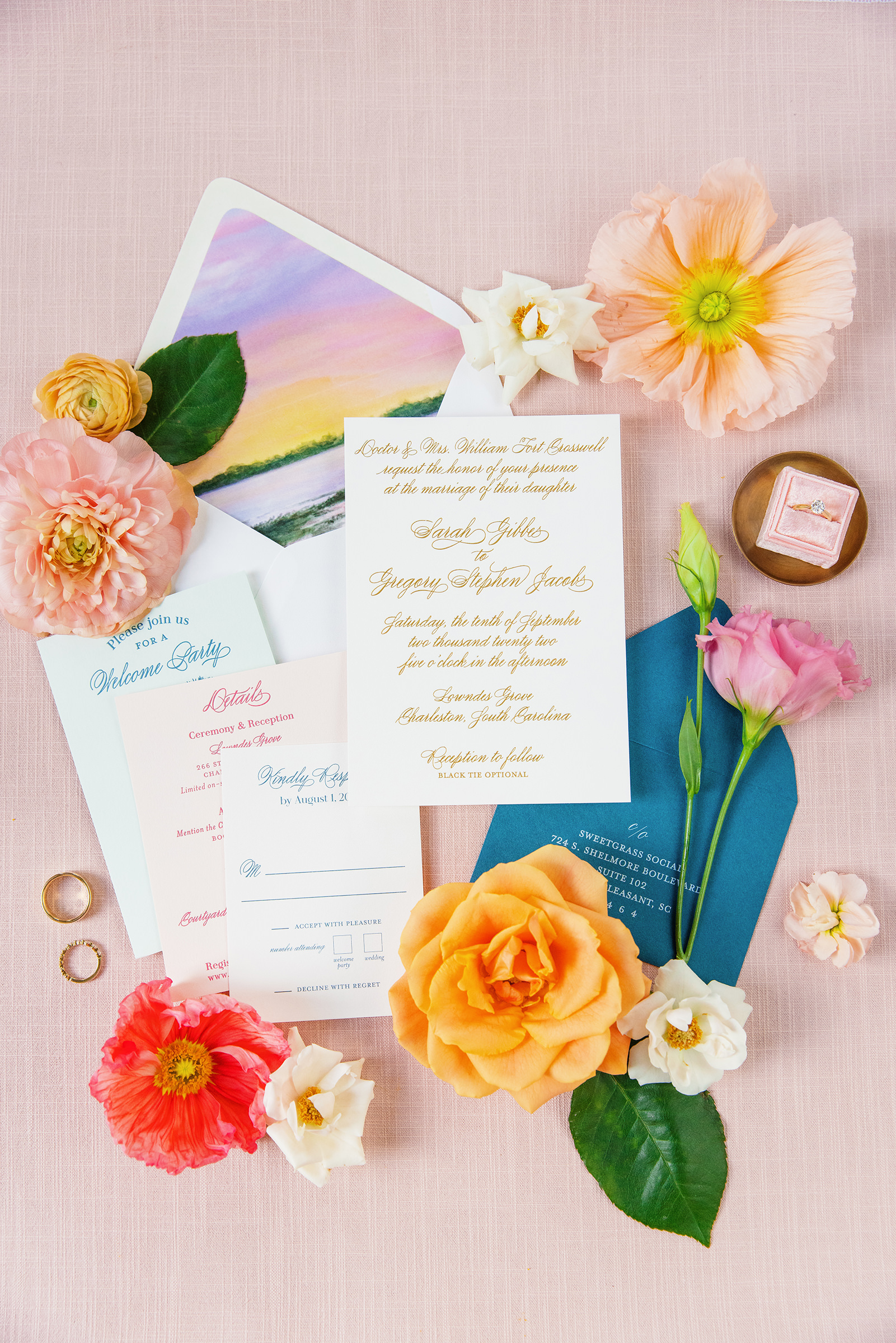 Colorful flat lay with stationery flowers and rings - photo by Dana ...