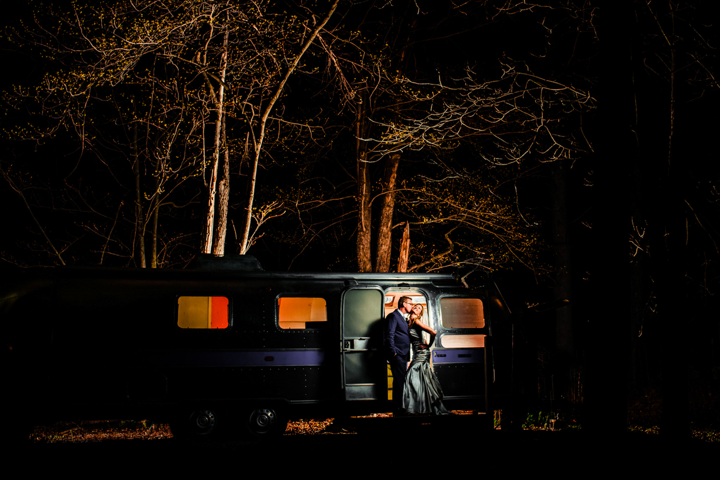 Couple campy pose at camper at night - photo by Stefy Hilmer Photography