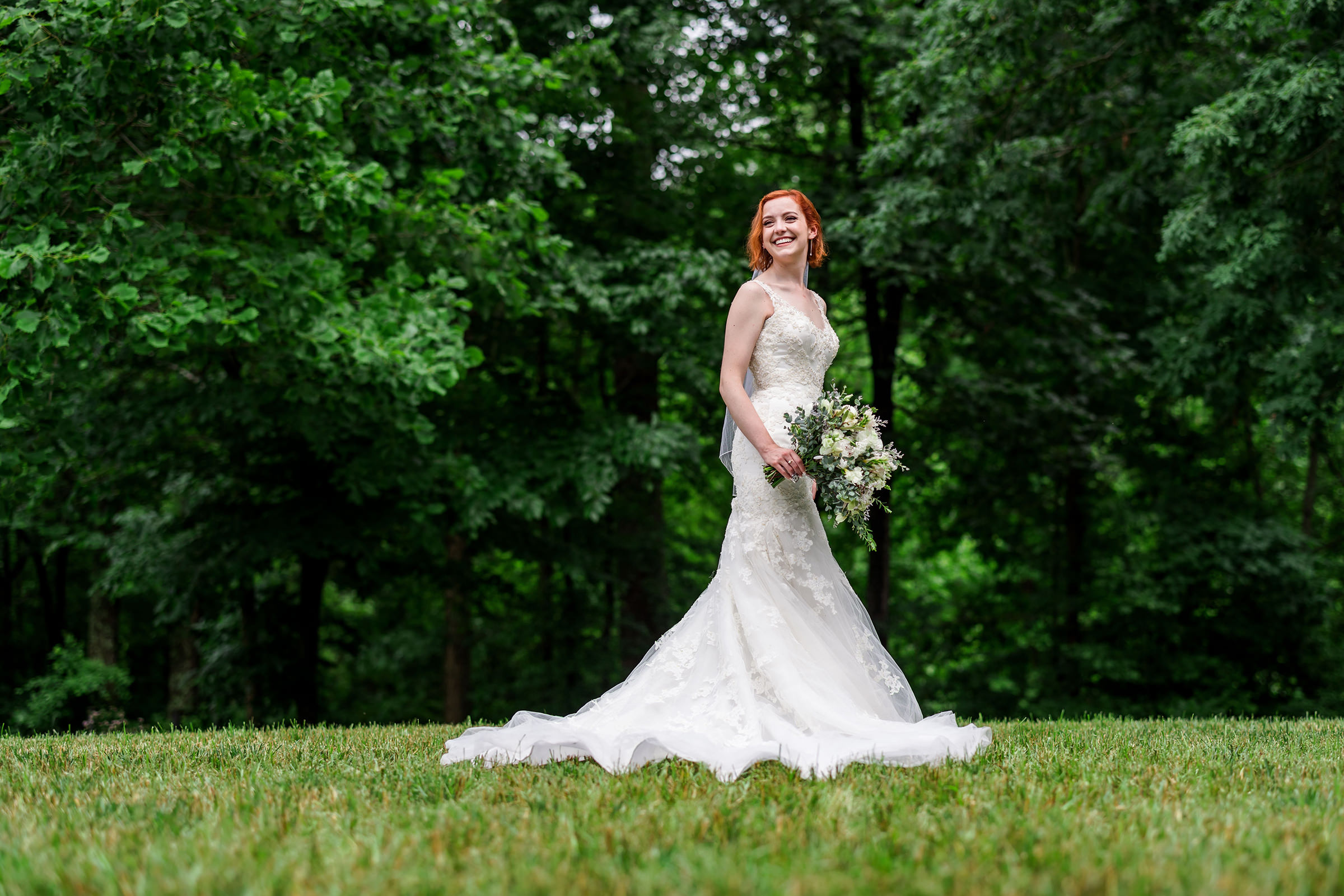 Full length smiling bride portrait in garden - photo by Xiaoqi Li ...