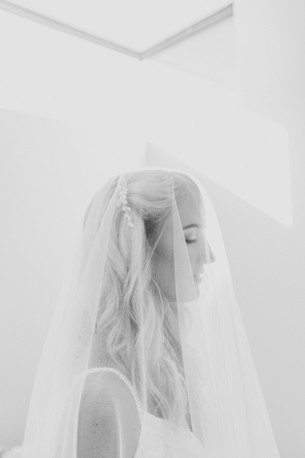 Portrait of profile contemplative veiled bride - photo by Sara France
