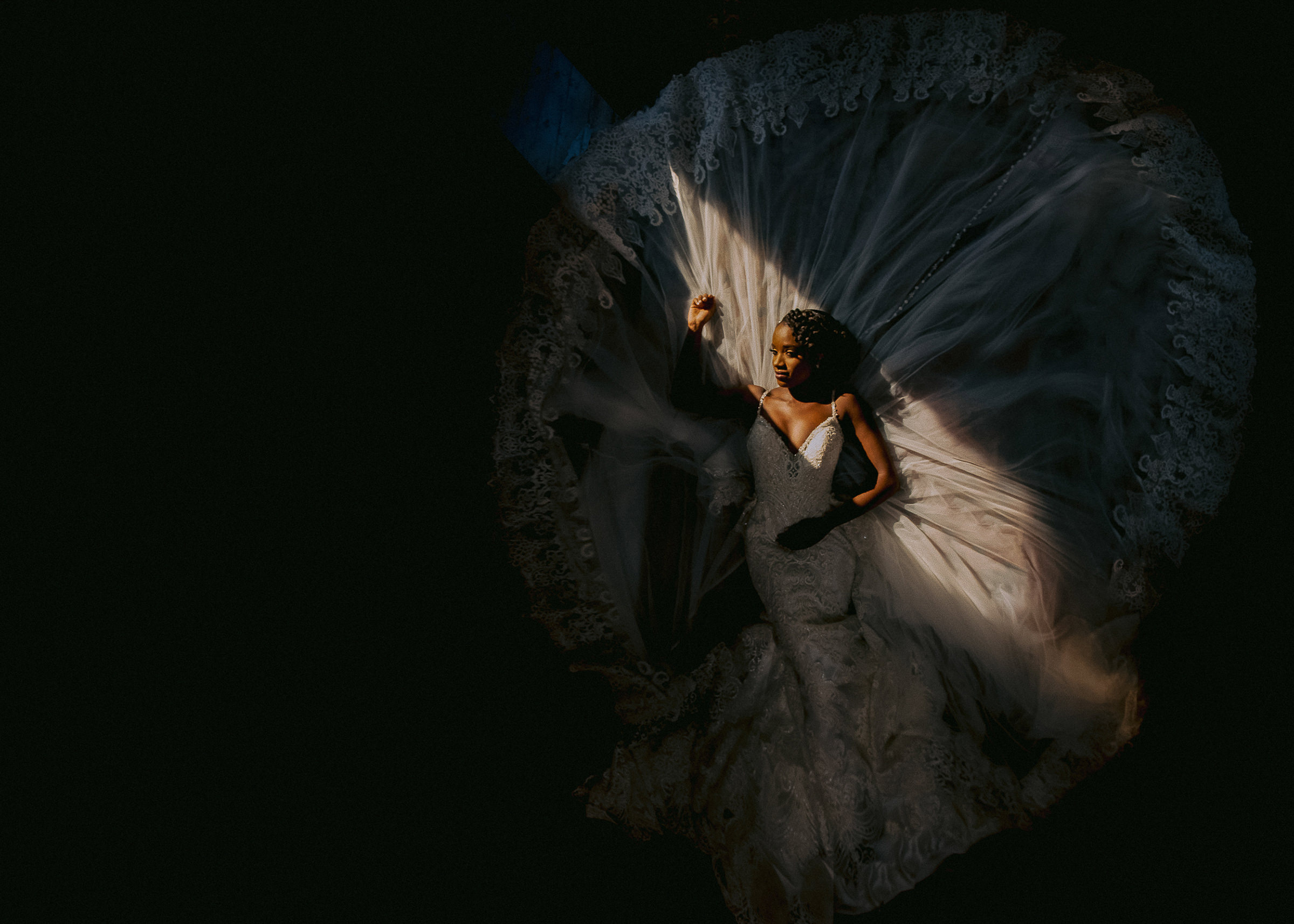 Reclining bride encircled by her train, photo by Kesha Lambert Photography