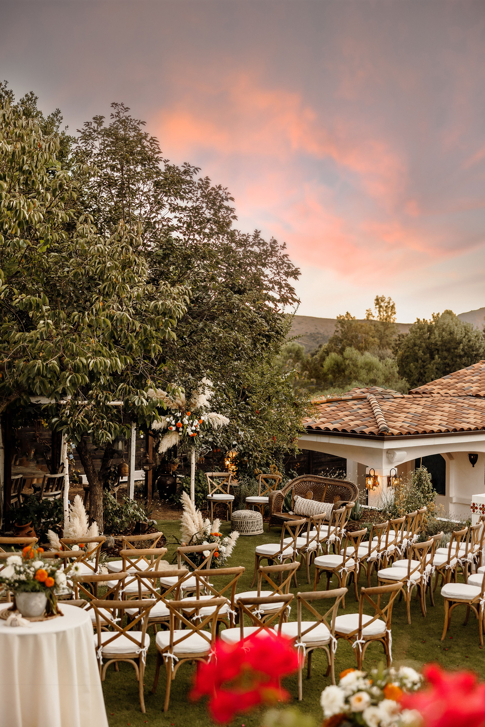 Sunset skies over outdoor ceremony venue, photo by Clewell Photography