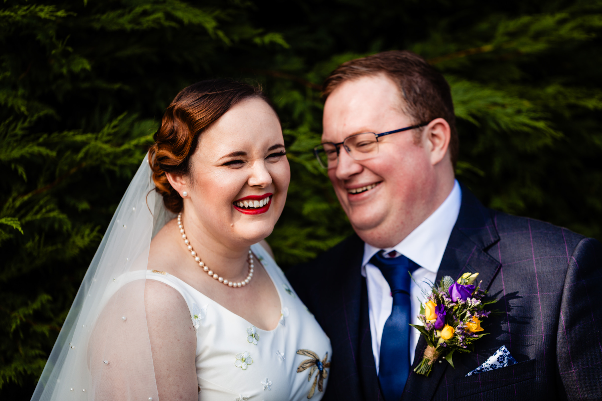 Grinning face to face couple portrait, photo by Emma + Rich