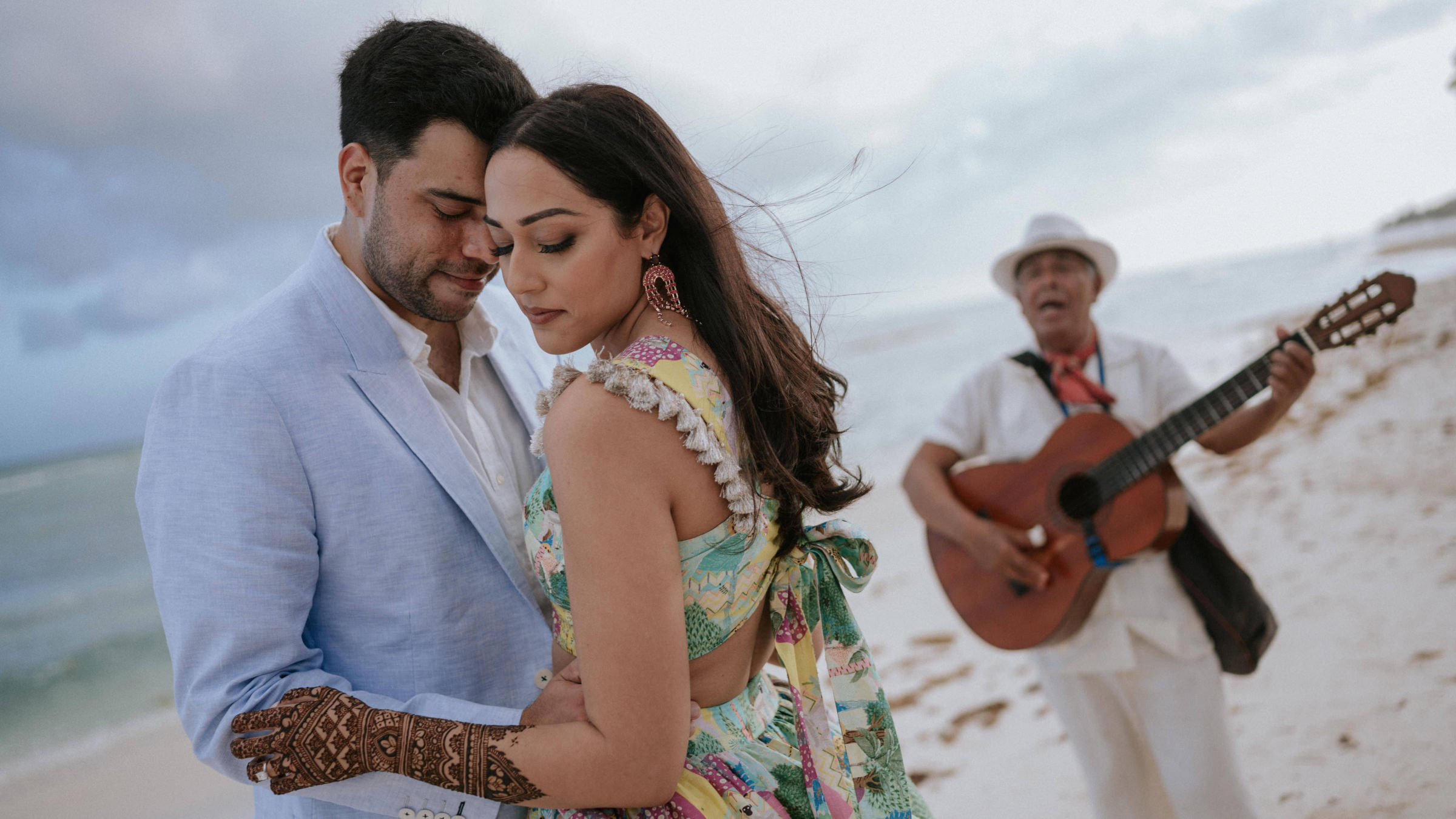 couple being serenaded on the beach, photo by Charmi Peña Photography