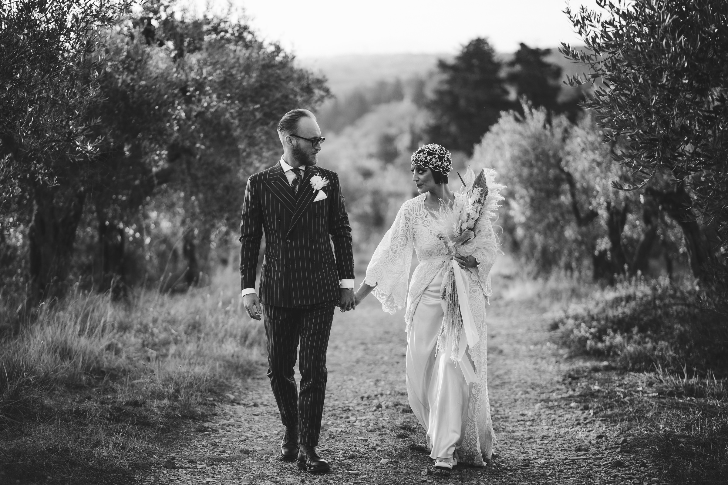 Flapper era style couple walking on path, photo by Matteo Innocenti ...