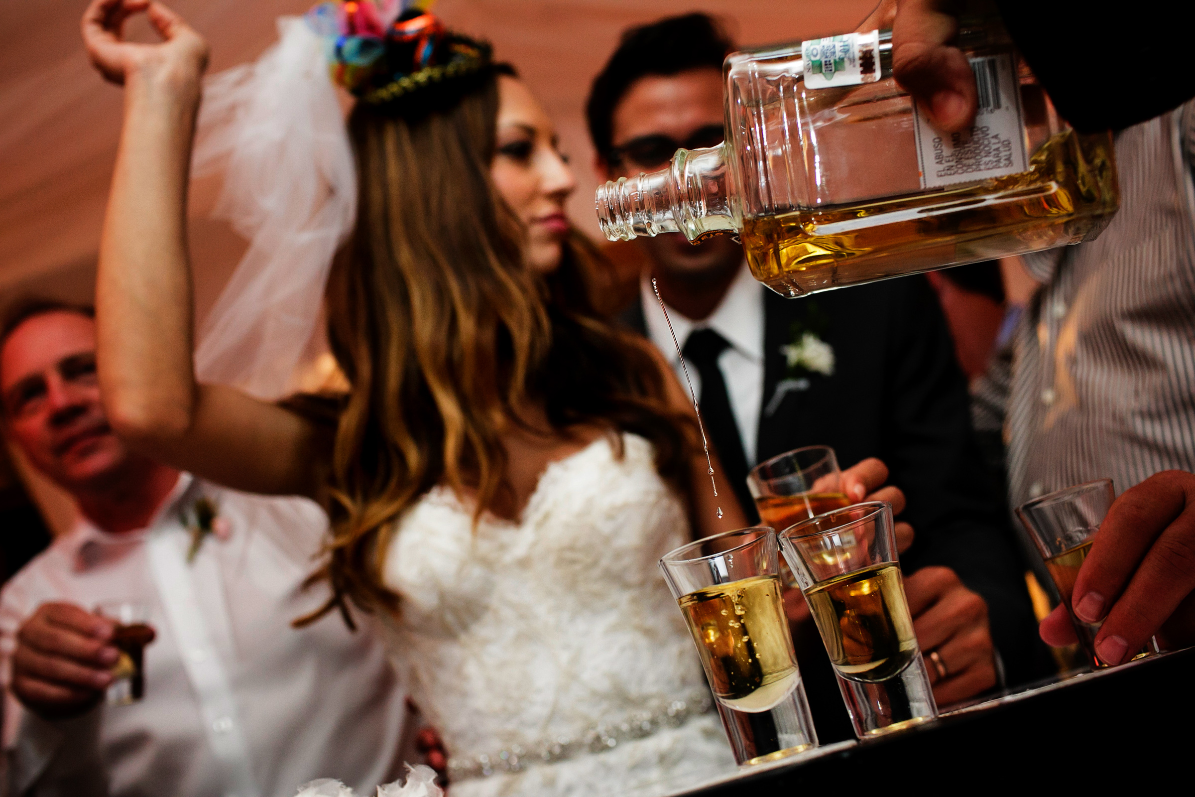 Pouring shots at party - photo by Chrisman Studios