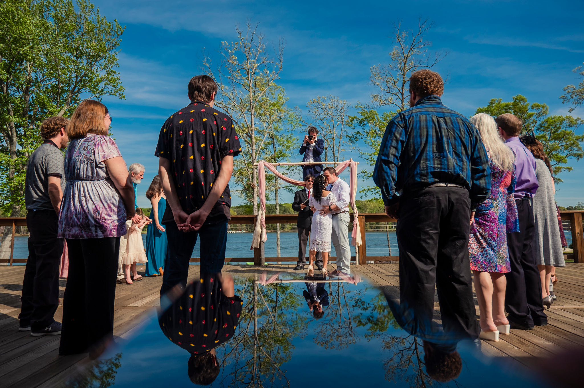 bride and grooms first kiss with view of lake murray- photo by Chrisman ...