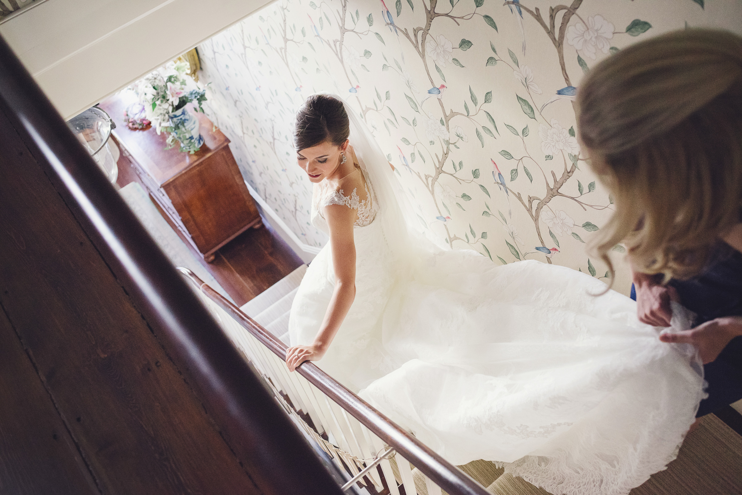 Top view of bride descending staircase - photo by Zofia & Co Photography