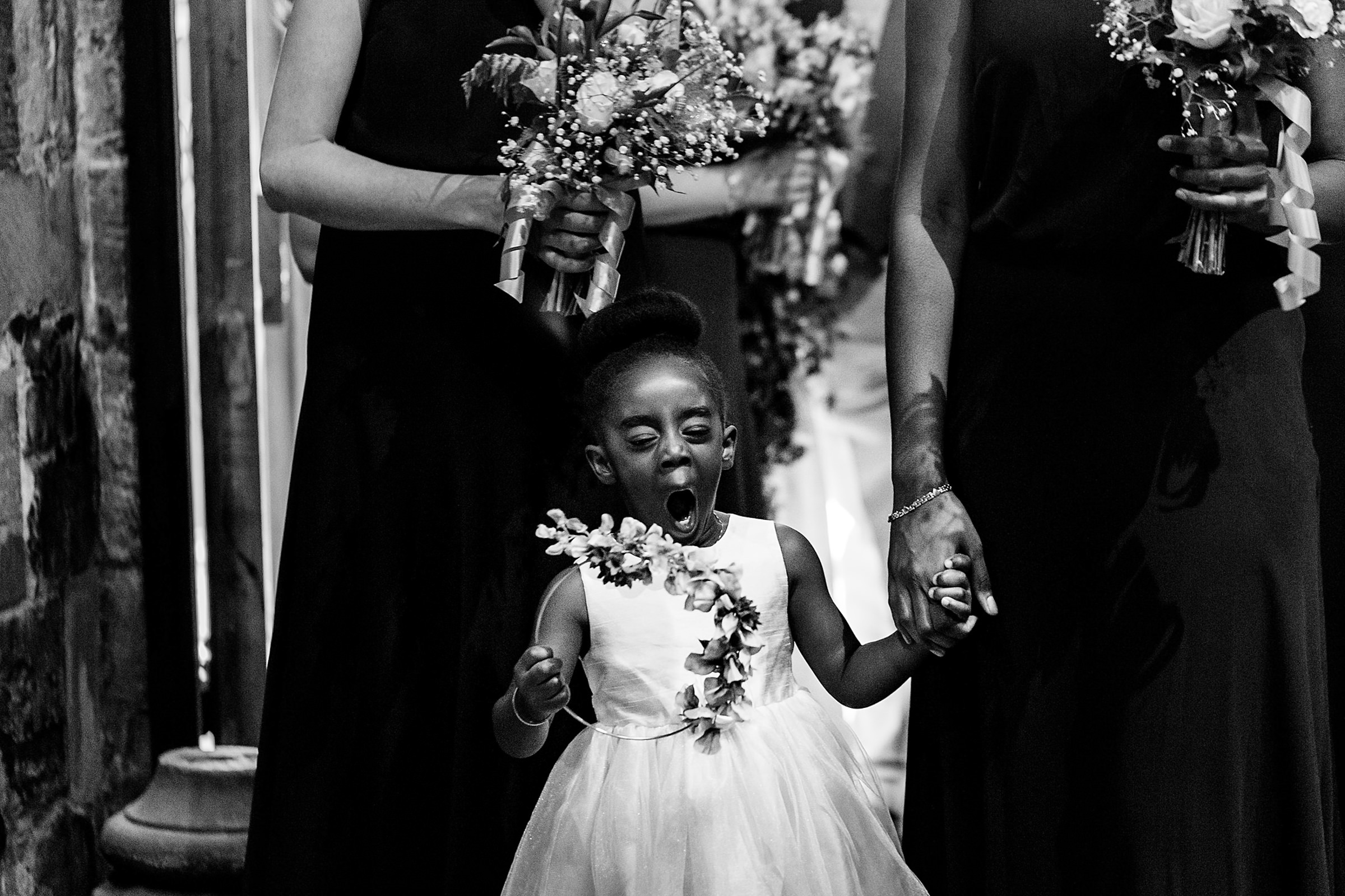 Flower girl yawning - photo by Emma + Rich